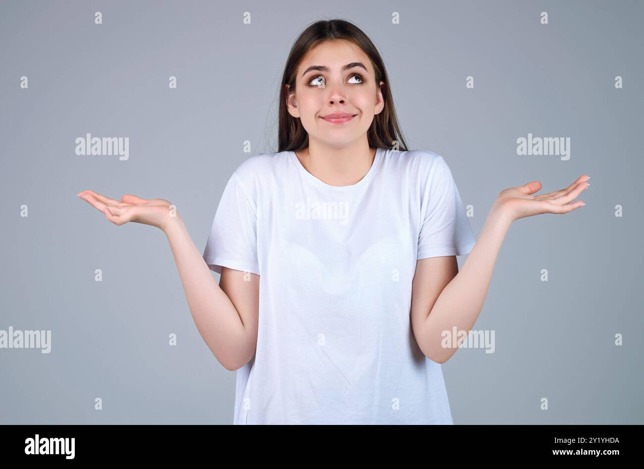 Portrait of thinking woman with confused puzzled face on studio ...