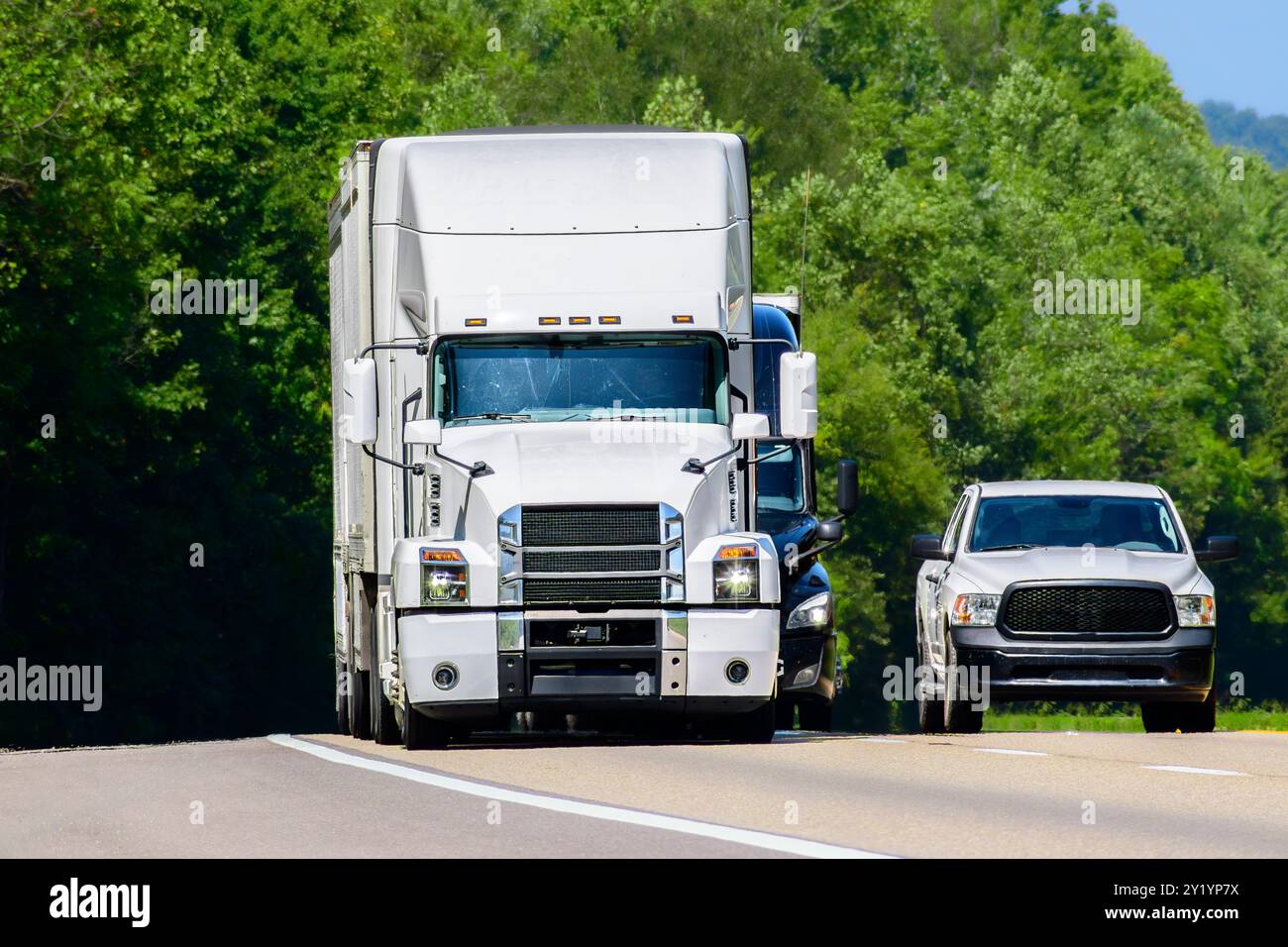 Horizontal shot of two white trucks on a Tennessee interstate Stock ...