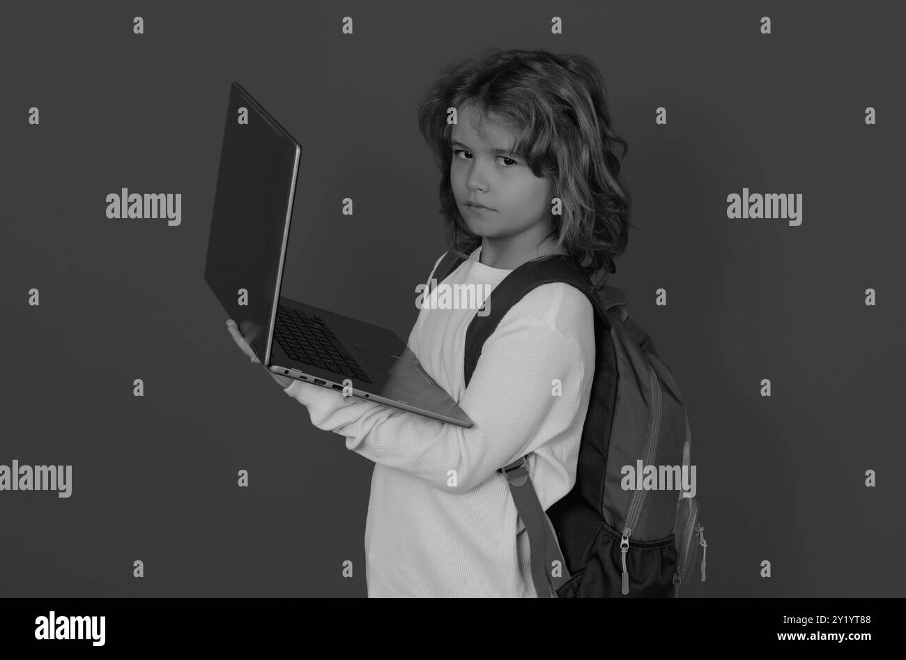 Schoolboy with laptop. School child student learning at school ...