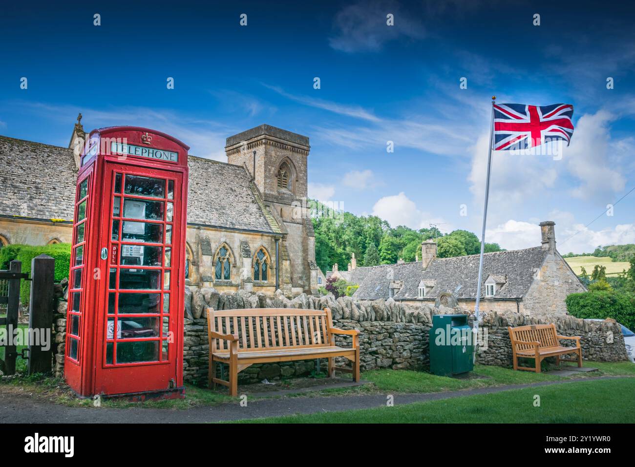 A classic British village with church, red telephone booth and Union ...