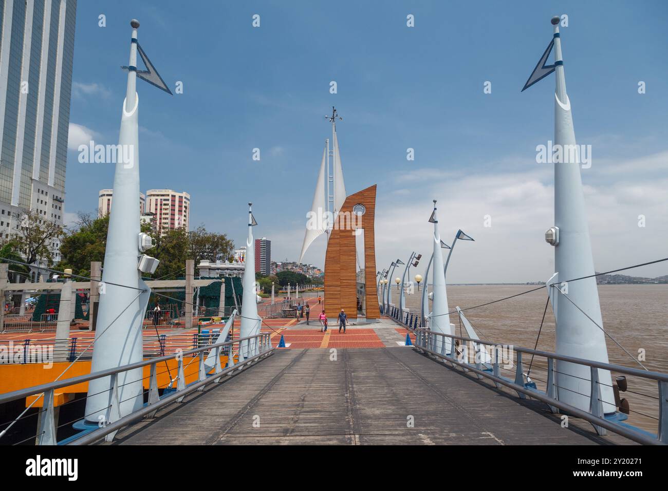 A Modern bridge at Malecon 2000 leading towards the sails monument and ...