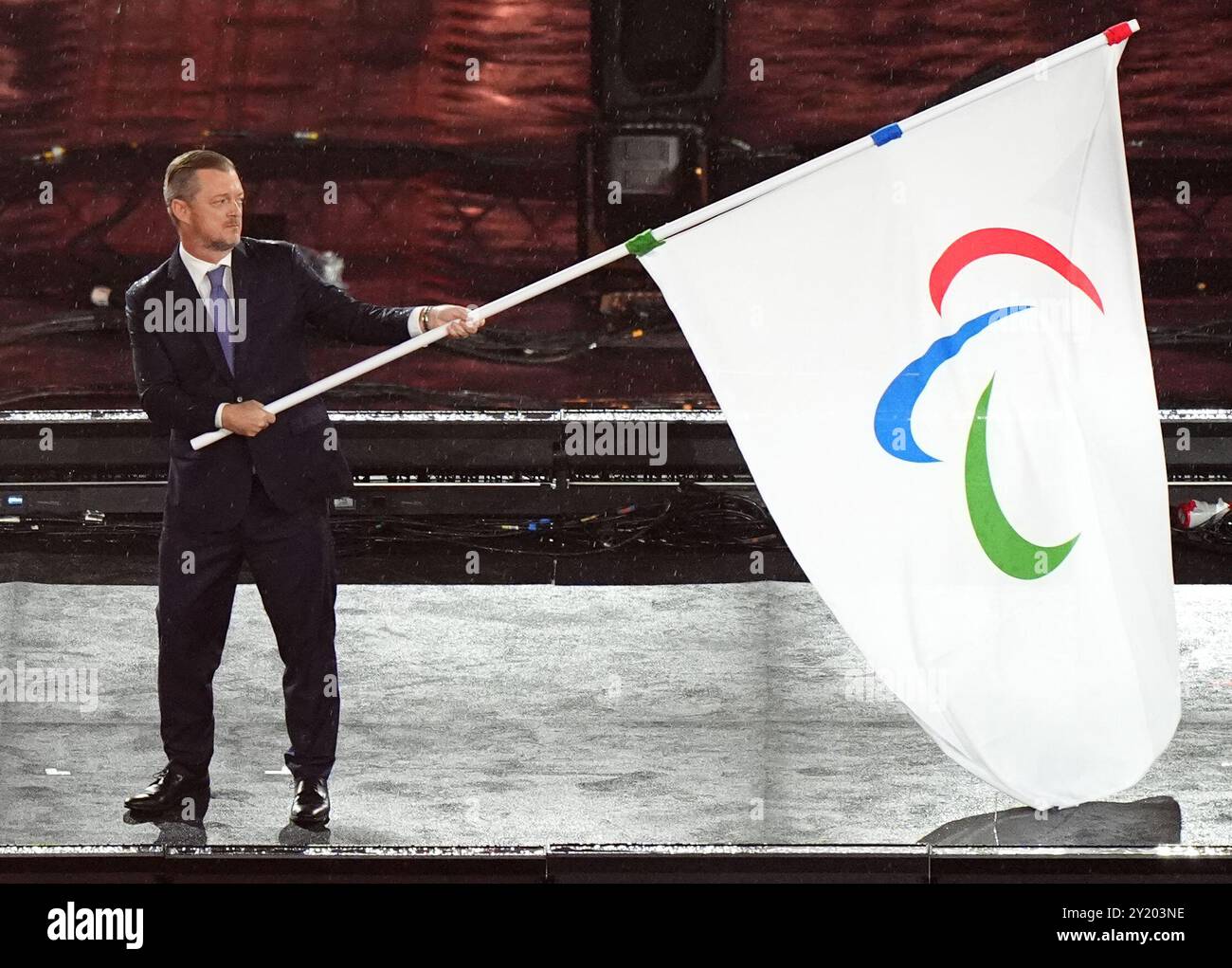 IPC President Andrew Parsons hands over the Paralympic flag during the ...