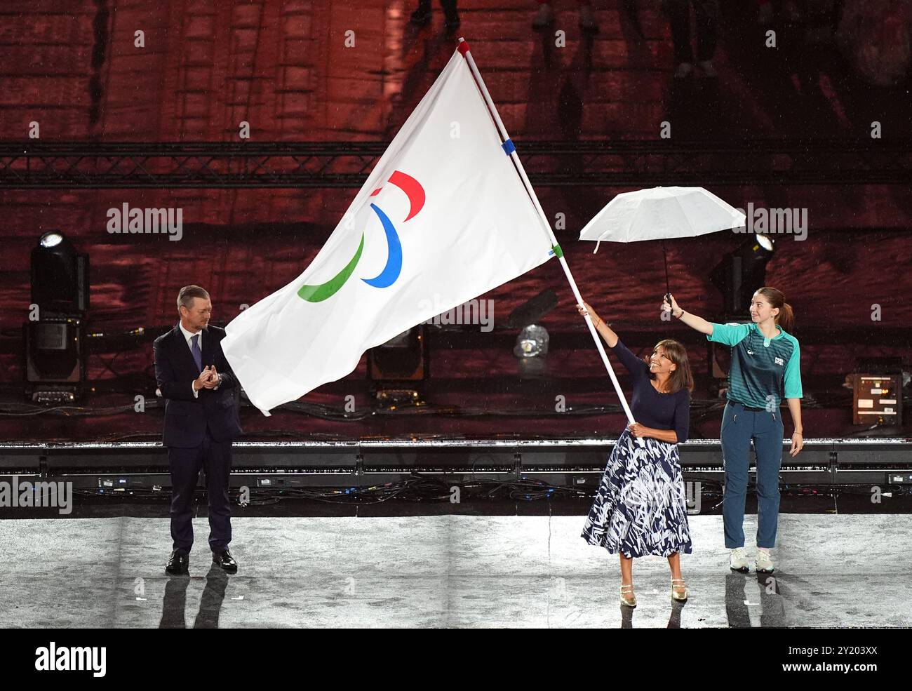The Mayor of Paris Anne Hidalgo passes the Paralympic flag to IPC ...