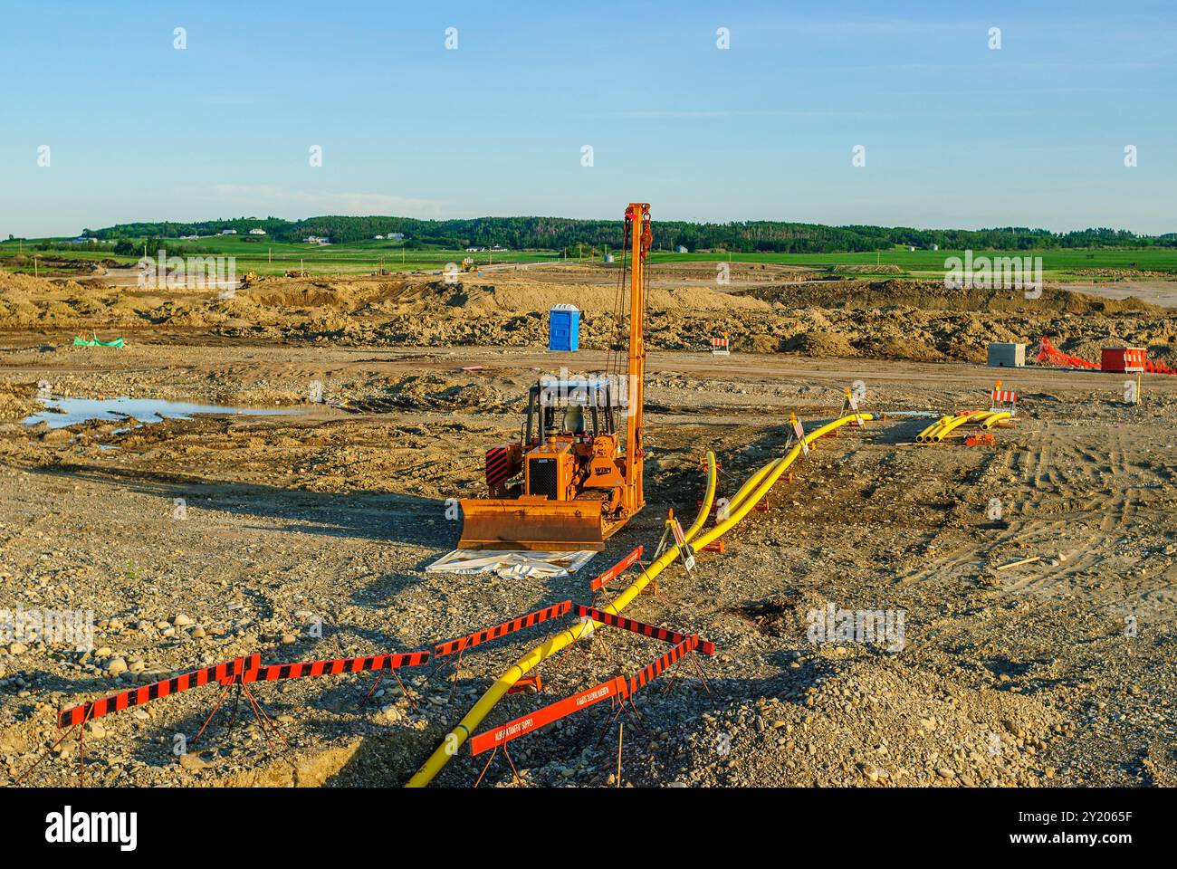 Installing a natural gas feeder line to a new residential subdivision ...