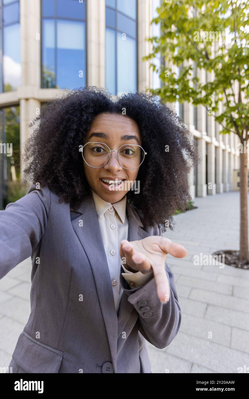 Confident African American businesswoman making video call using phone ...