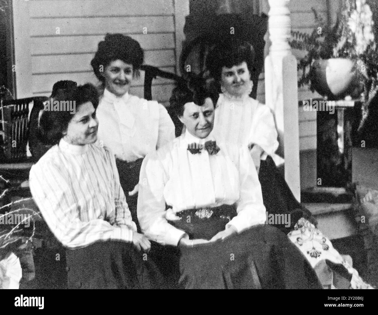 Four women seated on a front porch enjoying the afternoon, circa 1910 ...