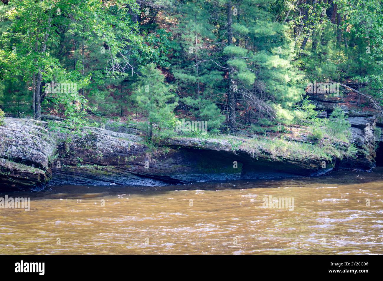 The rocky shoreline of Cambrian sandstone along the Wisconsin River in ...