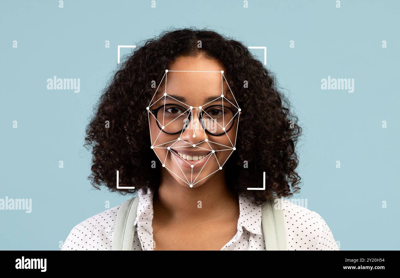 Woman smiling in front of a light blue background with facial ...