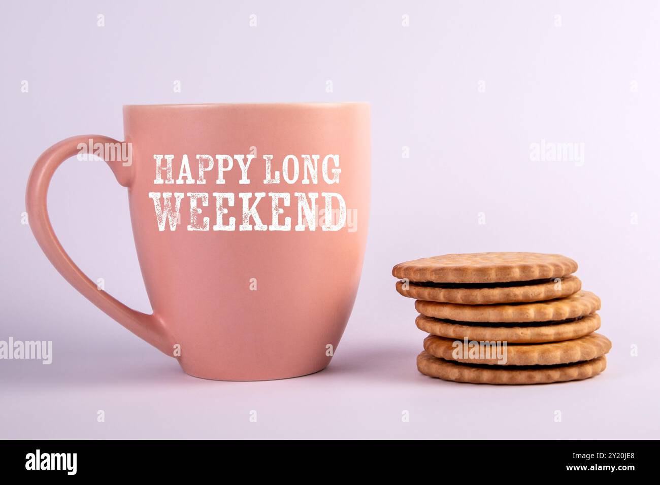 Happy Long Weekend. Motivational text on a coffee mug Stock Photo - Alamy