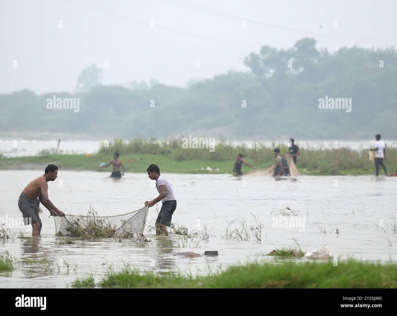NOIDA, INDIA - SEPTEMBER 7: People fishing in the Yamuna River. The ...