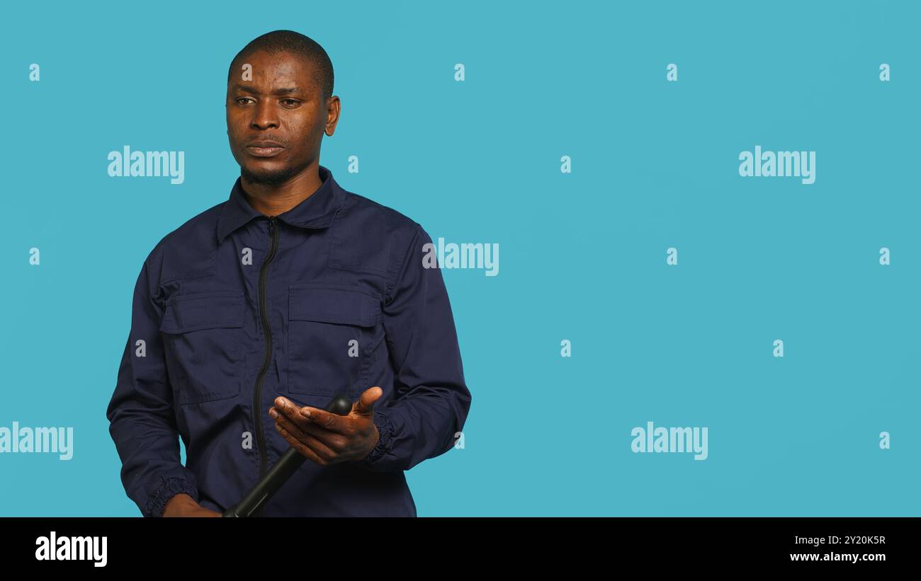 Security guard smacking hand with baton, intimidating suspects ...