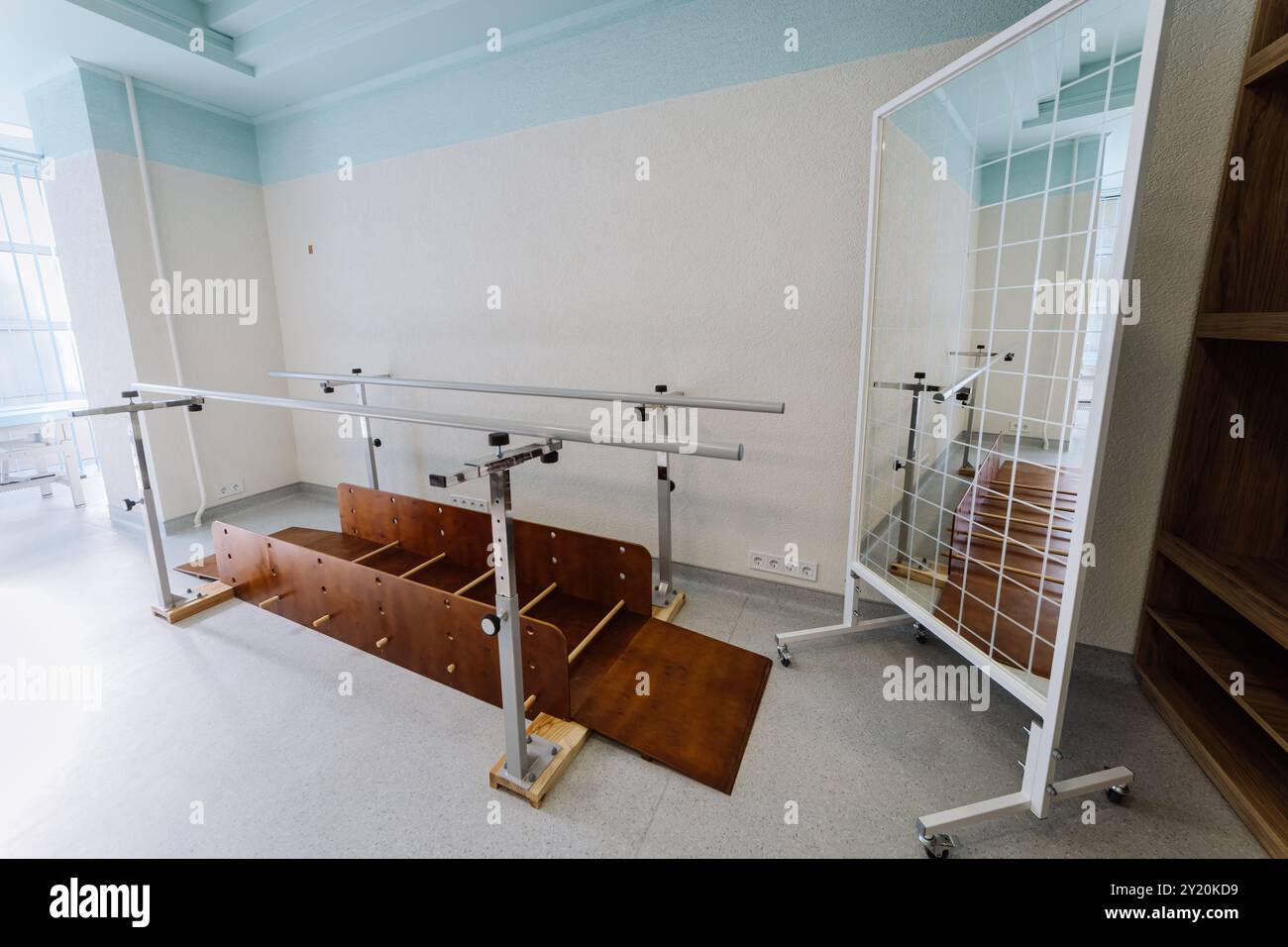 Rehabilitation equipment room with parallel bars and exercise balls for ...