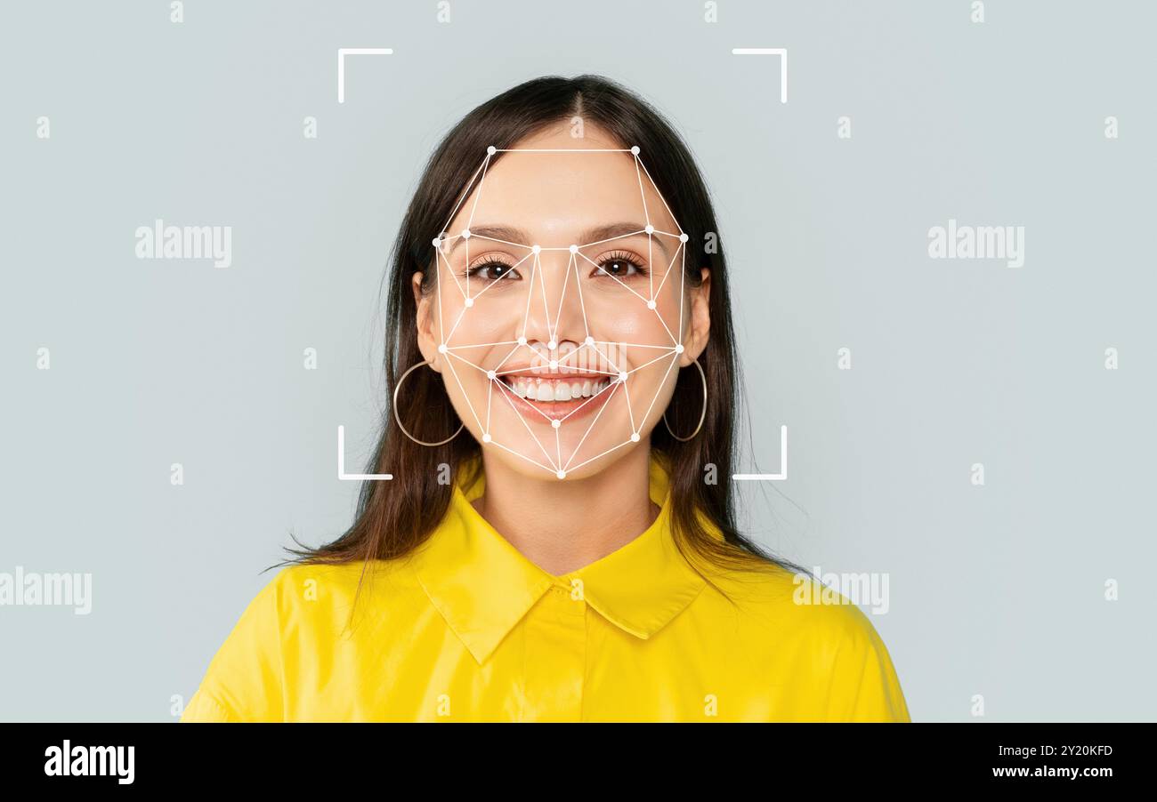 Woman smiling against light blue background with facial recognition ...
