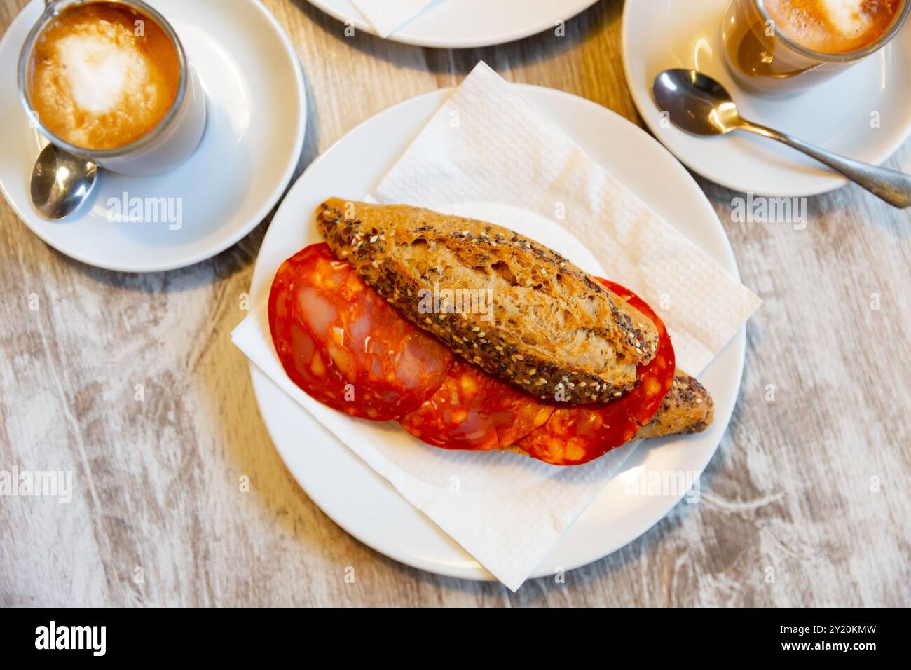 Typical spanish breakfast is smoked sausage sandwich on crispy bun ...
