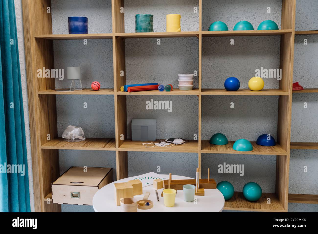 Rehabilitation therapy tools and equipment on shelves in a modern ...