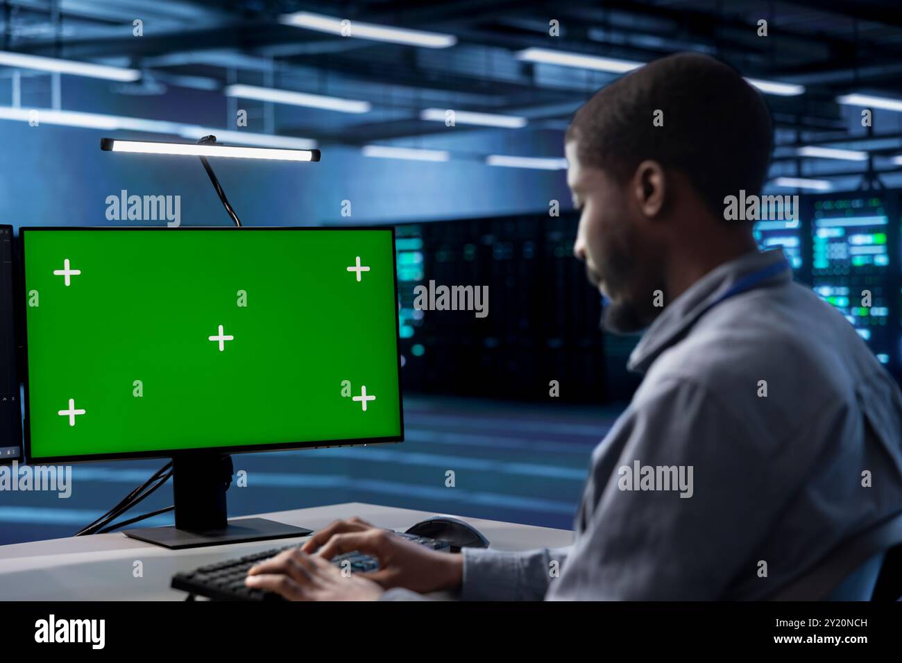 Technician In Server Hub Ensuring Data Remains Shielded From Potential