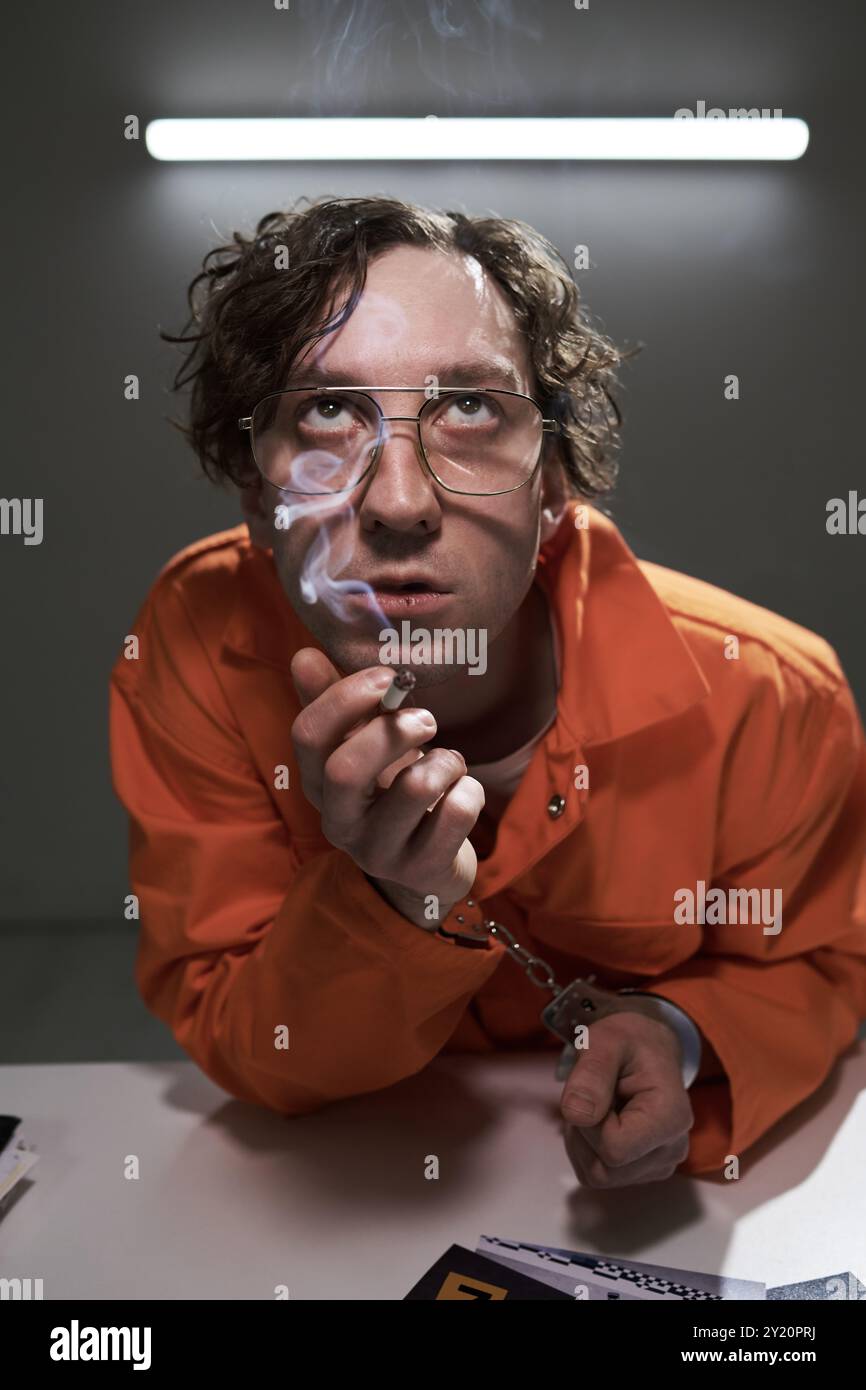 Man smoking in shadows hi-res stock photography and images - Alamy