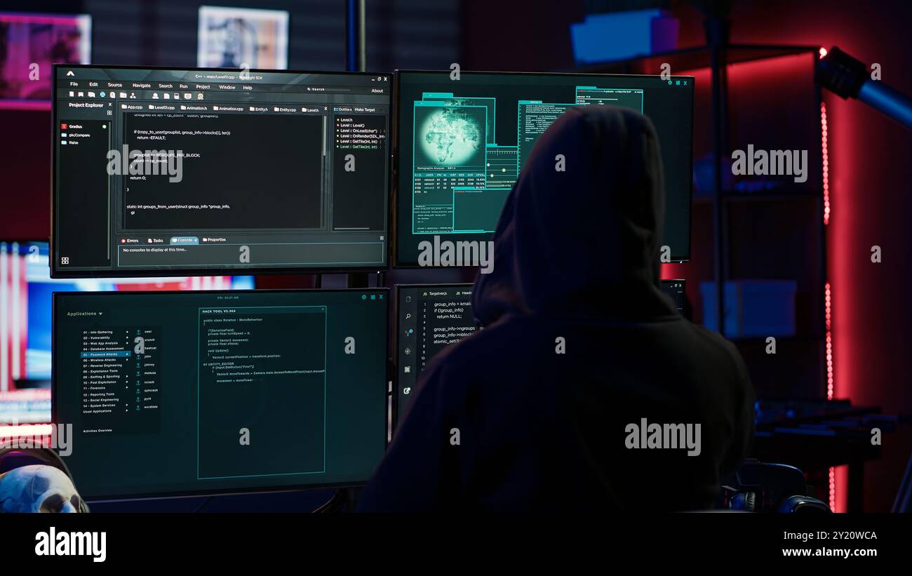Experienced hacker writing lines of code on computer from underground ...
