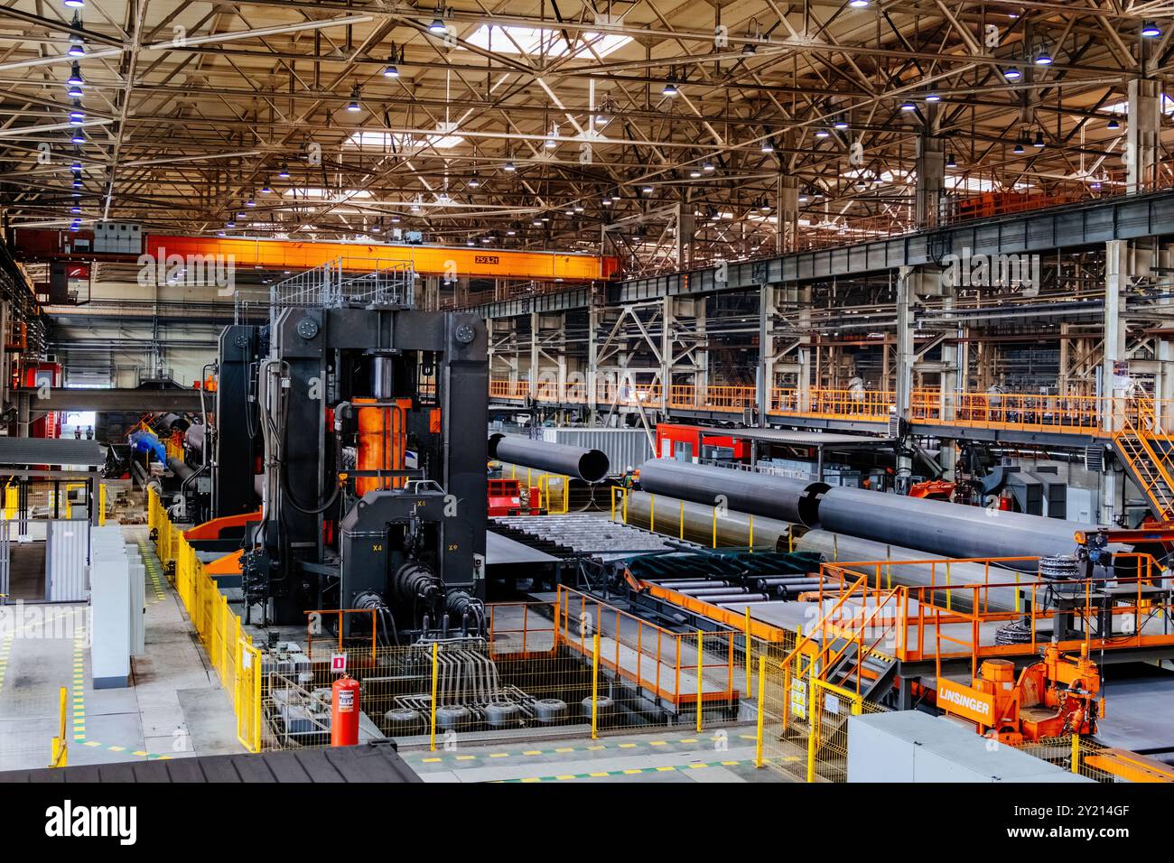 Pipe factory production line. Tube formation by roll sheet bending ...