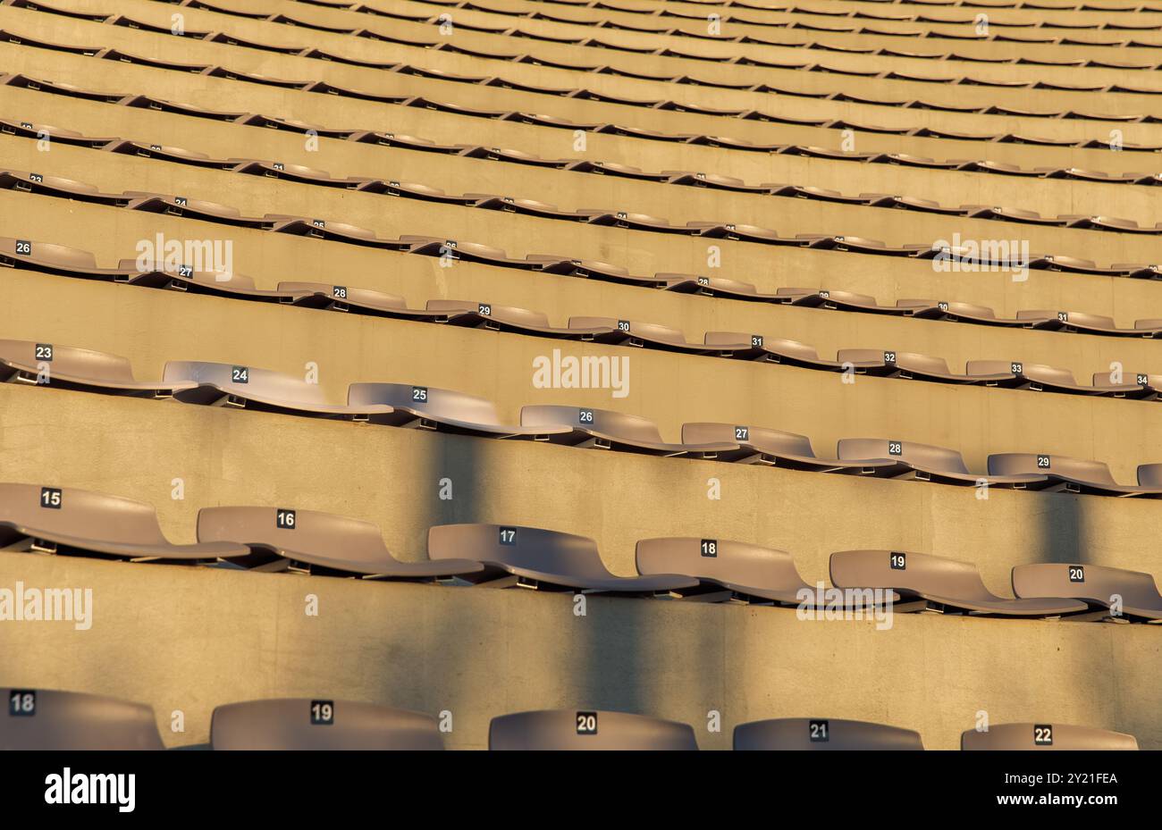 Numbered stadium seats, empty rows, orderly arrangement, capturing ...