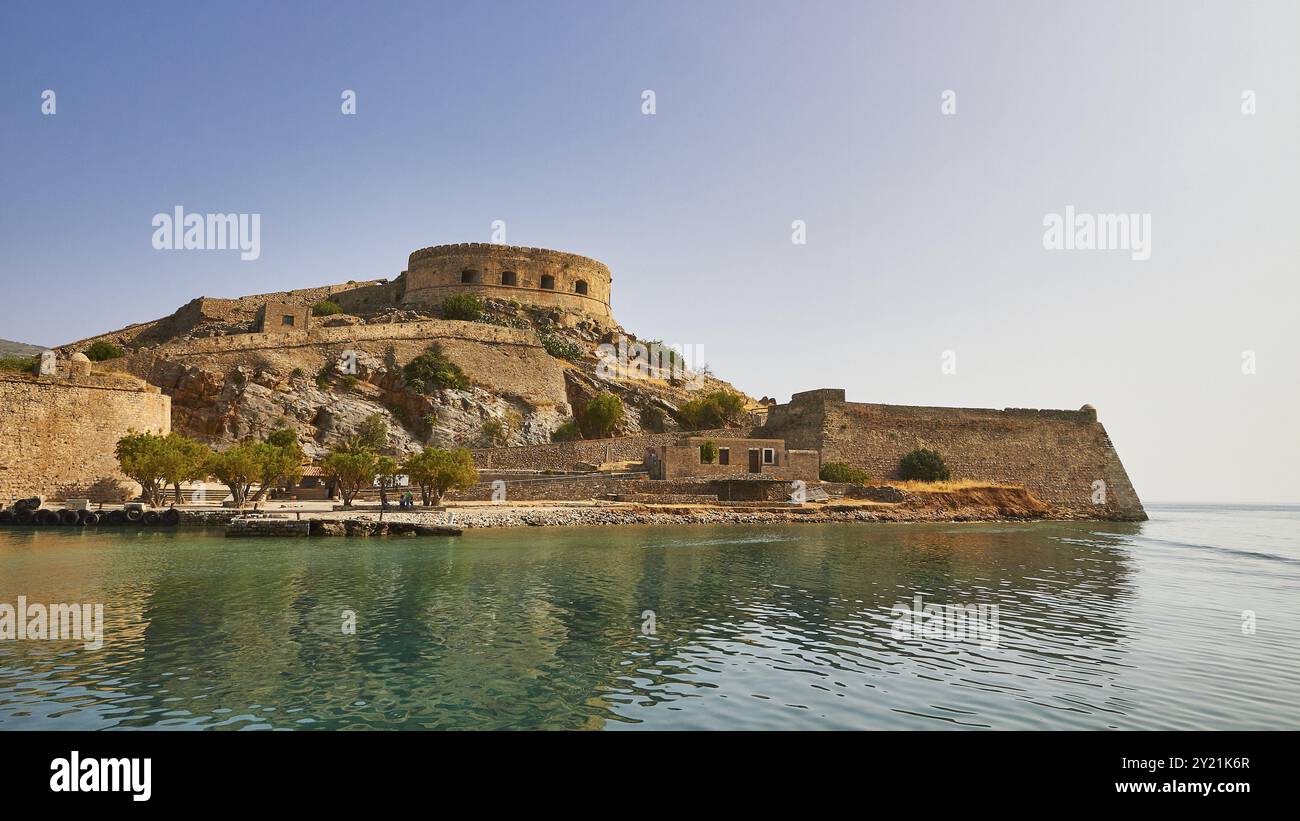 A fortress on the coast with a round tower, old stone walls and a view ...