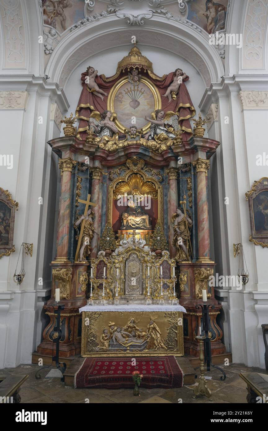Side altar in the 18th century baroqueised Basilica of St. Mauritius ...