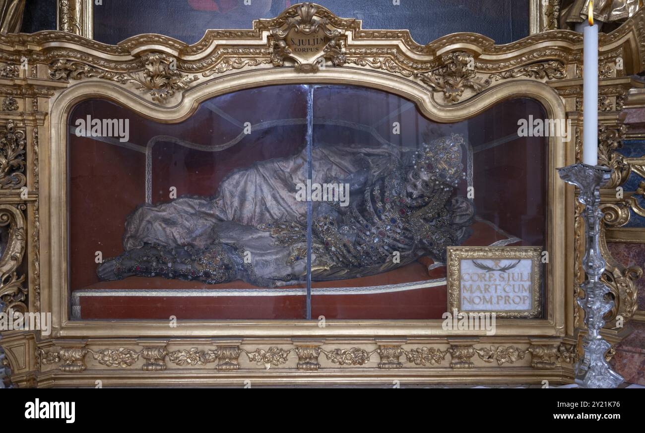 Magnificent glass shrine with decorated bones of a catacomb saint ...