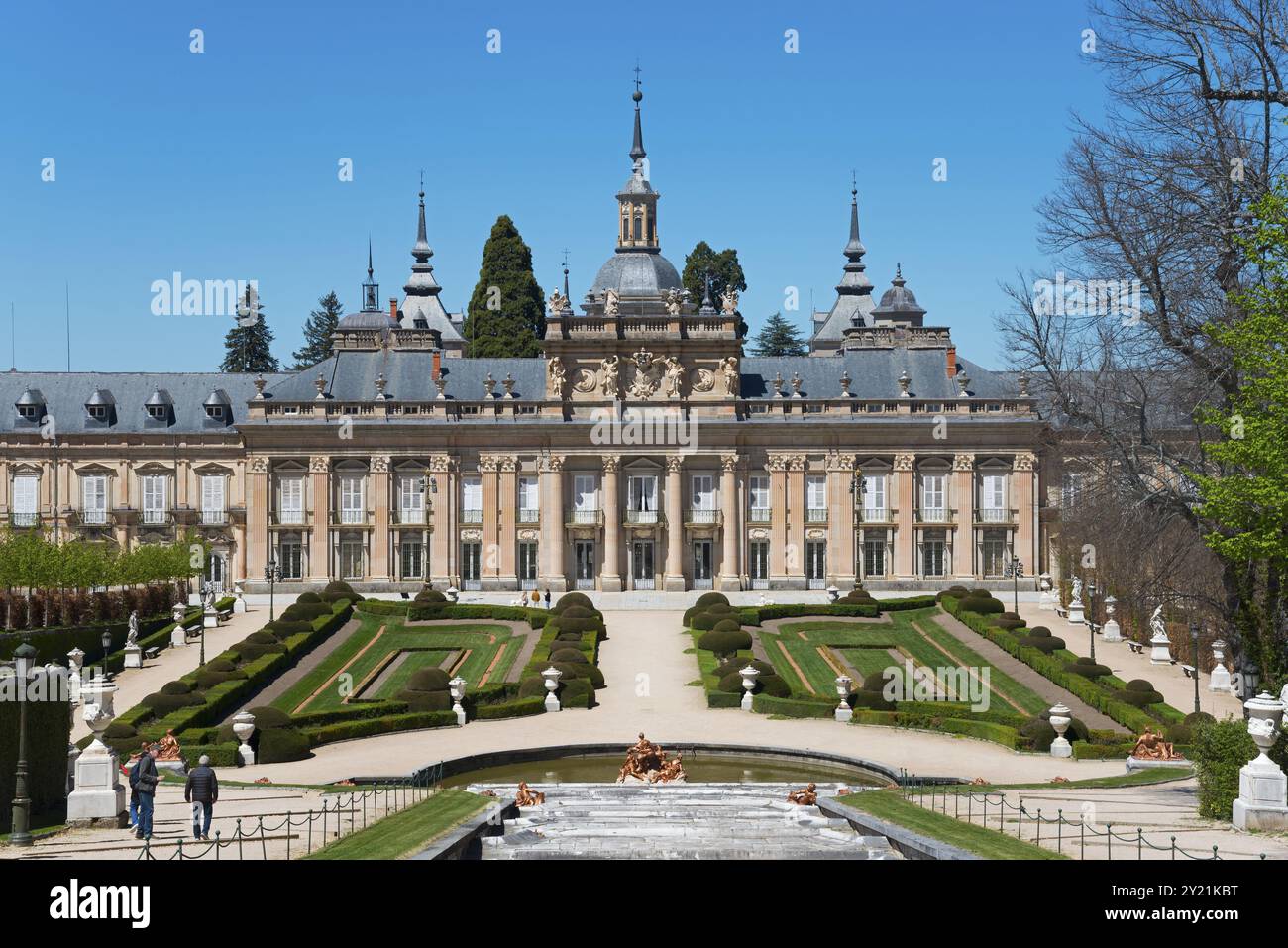 Historic palace with symmetrical formal garden and sculptures in sunny weather, Royal Castle La ...