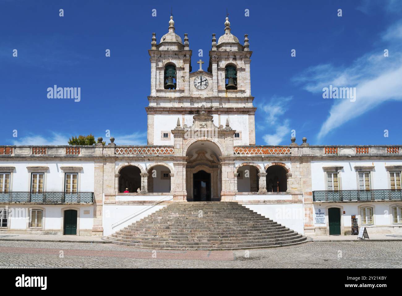 Historic church facade with two bell towers, central entrance, stone ...