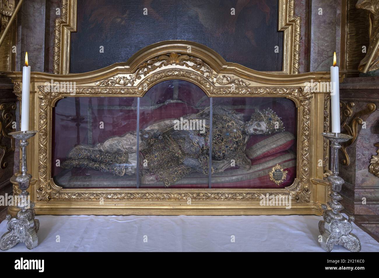 Magnificent glass shrine with decorated bones of a catacomb saint ...