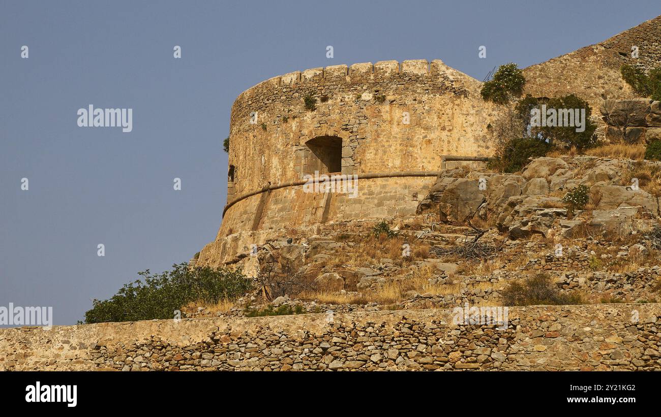 Old round stone tower on rocky ground with clear sky, Venetian Sea ...