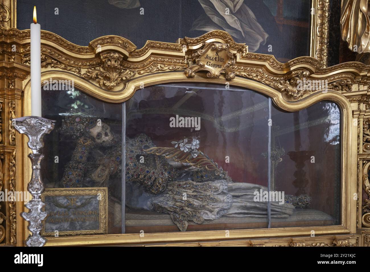 Magnificent glass shrine with decorated bones of a catacomb saint ...