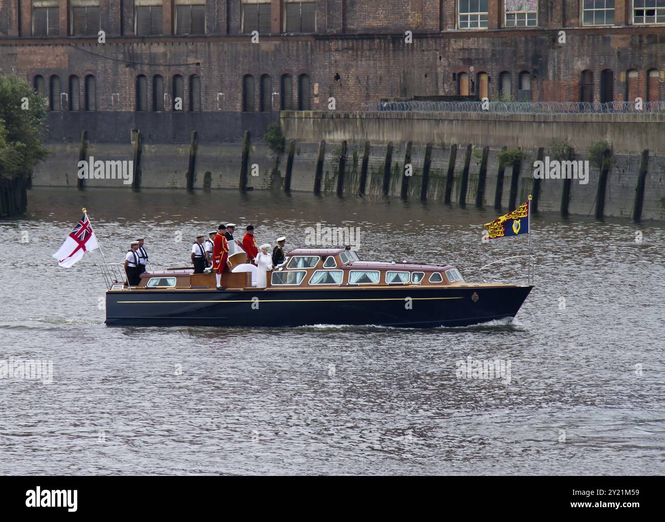 Queen Elizabeth II and Prince Philip on a motor launch at the start of ...