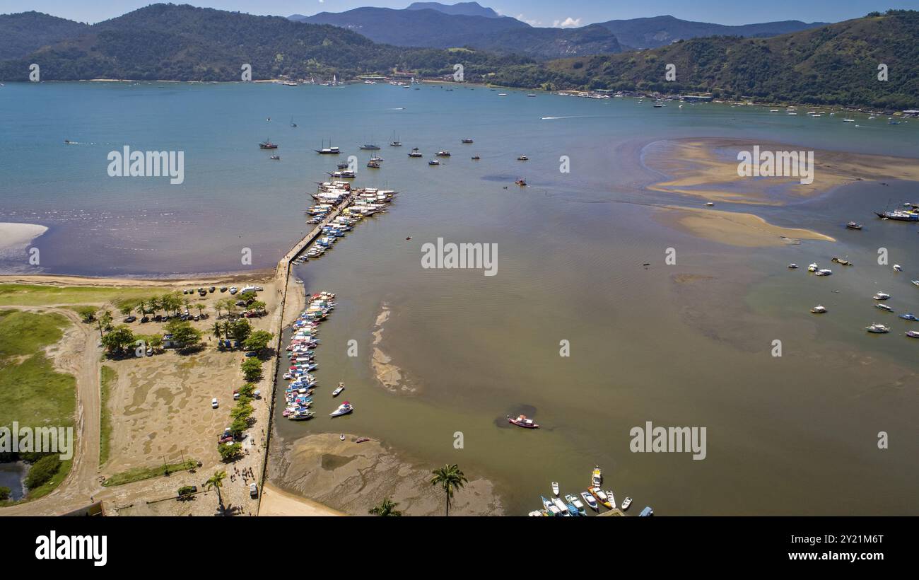 Aerial view to historic Paraty pier and harbour with green mountains in ...