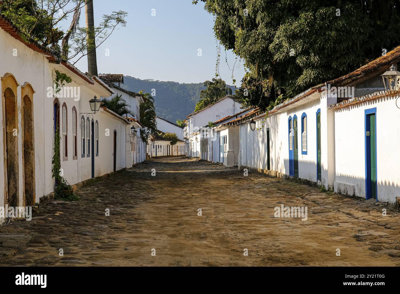 Typical cobblestone street covered with mud from high tide with ...