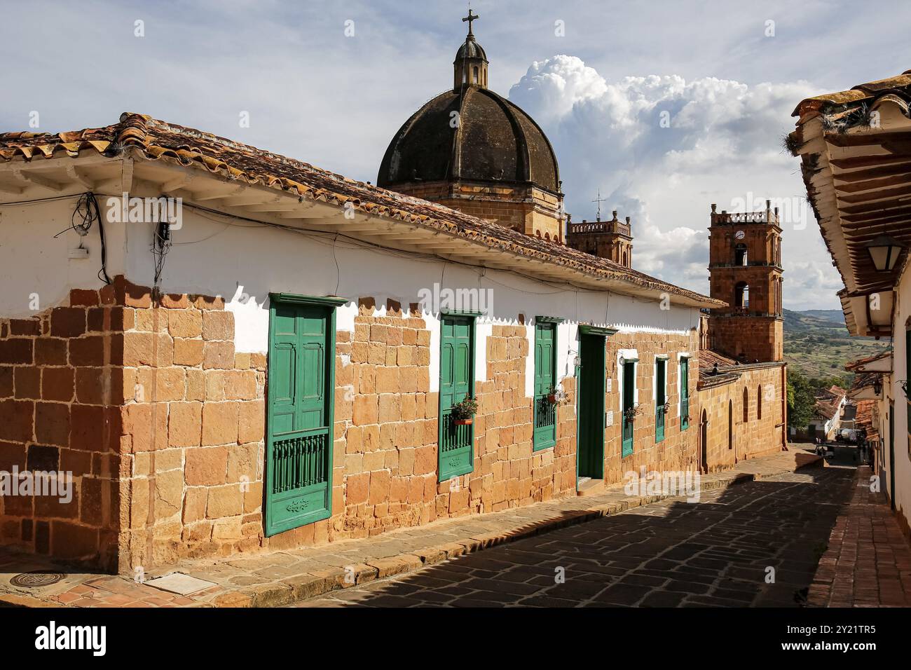 Close-up view to a street with typical traditional houses and cathedral ...
