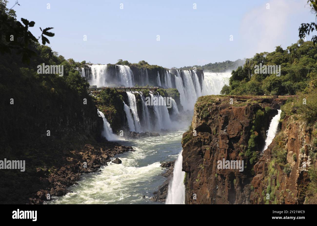 Iguassu waterfalls on a sunny day early in the morning. The biggest ...