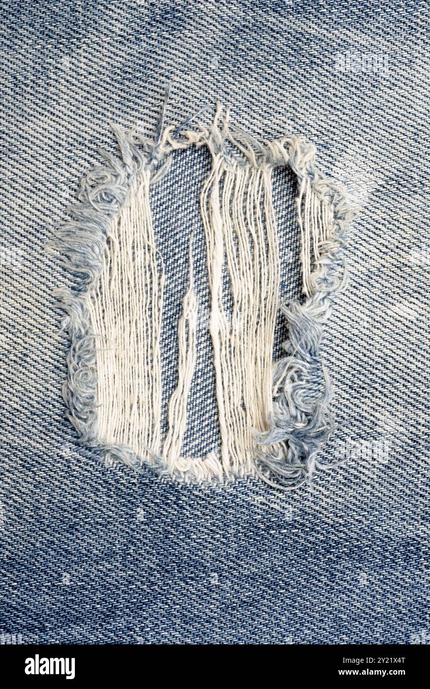 Ripped denim blue jeans. Denim jeans fashion background. Blue jean ...
