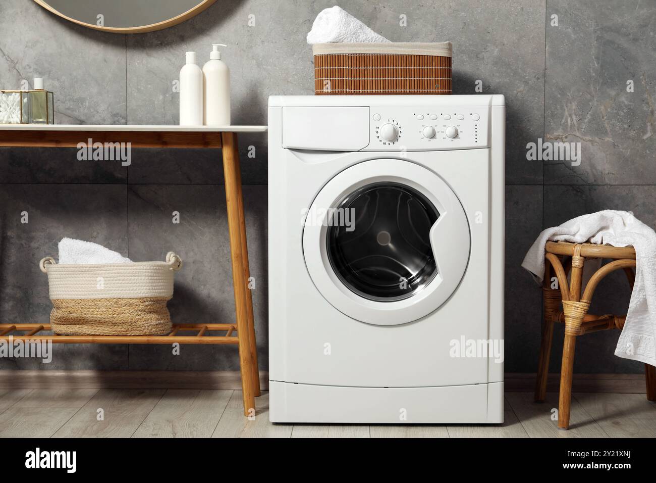 Washing machine, storage bench and chair indoors Stock Photo - Alamy