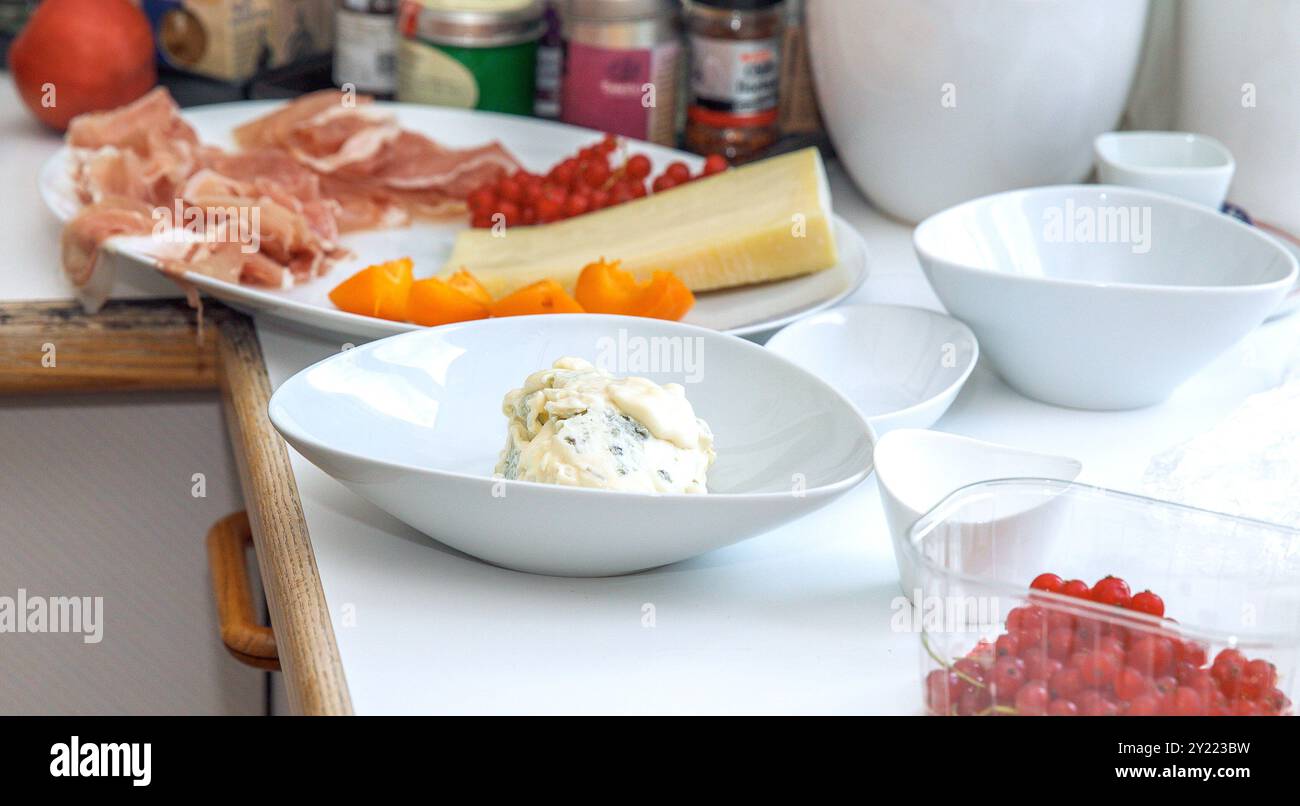 Gourmet meal ingredients assortment, featuring cheese, cured meats ...