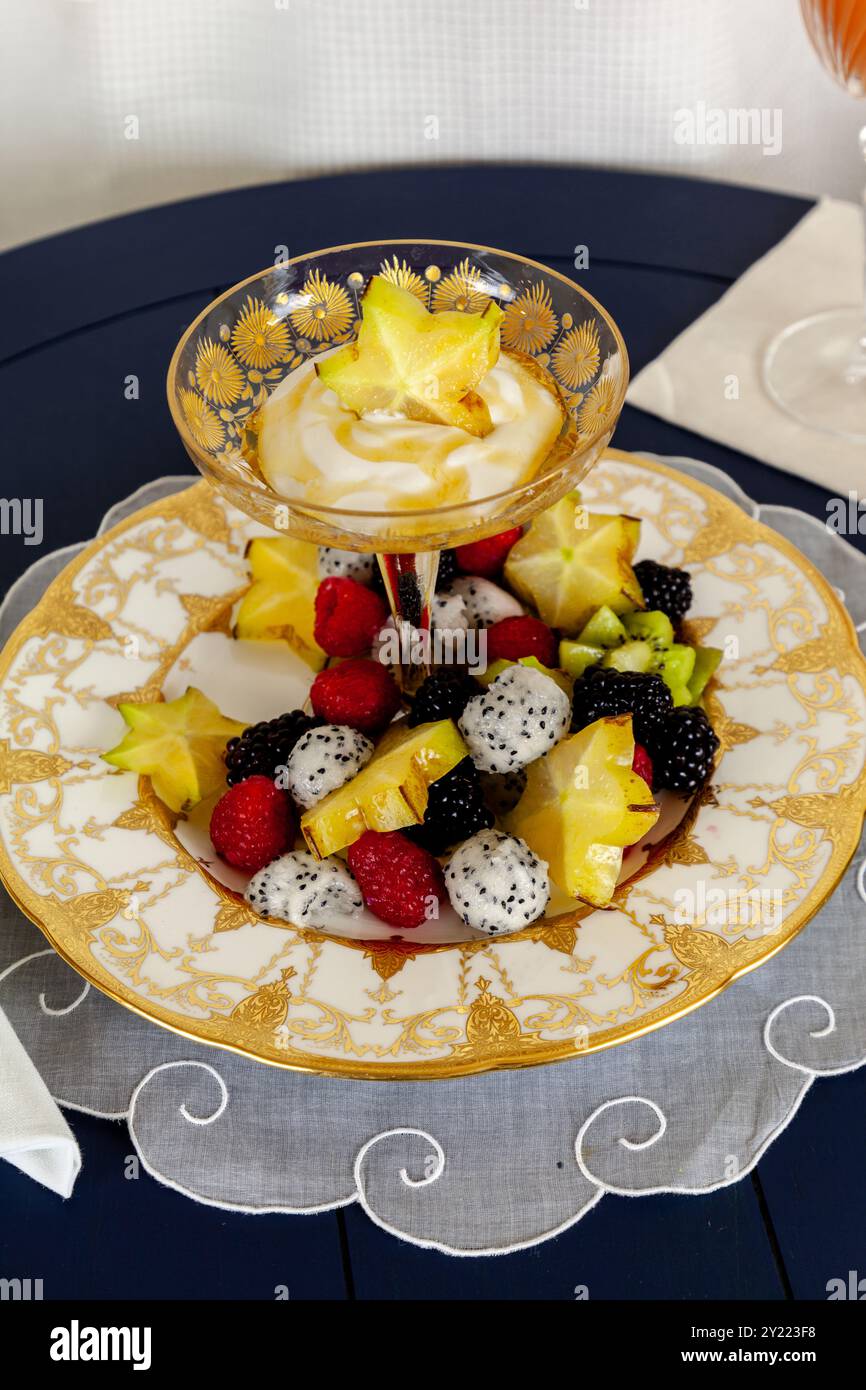 Fancy fruit salad with dragon fruit, star fruit, raspberries ...