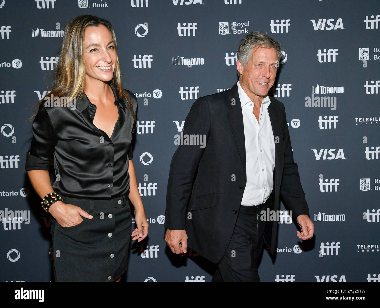 Hugh Grant, right, and wife Anna Elisabet Eberstein attend the "Heretic ...