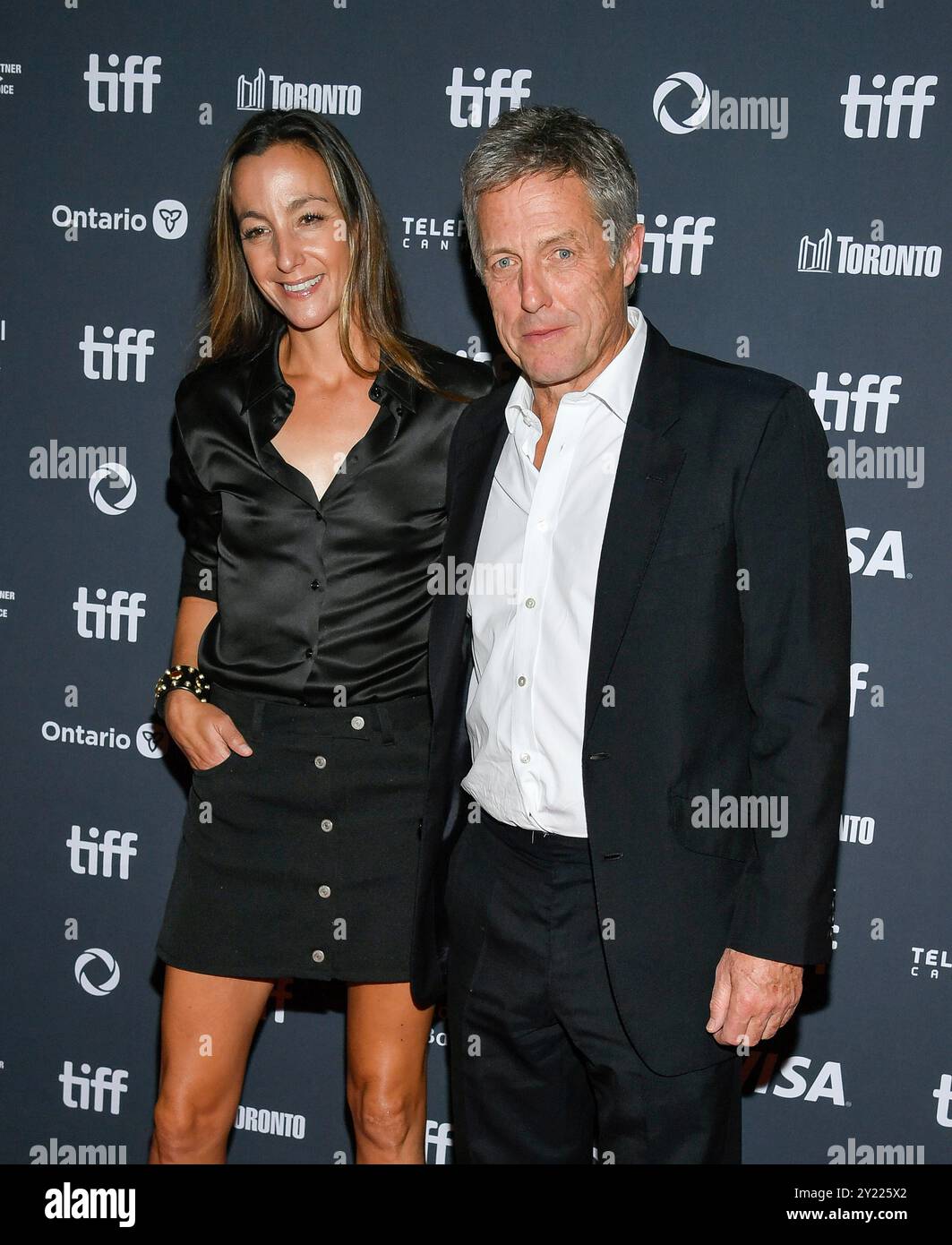 Hugh Grant, right, and wife Anna Elisabet Eberstein attend the "Heretic ...