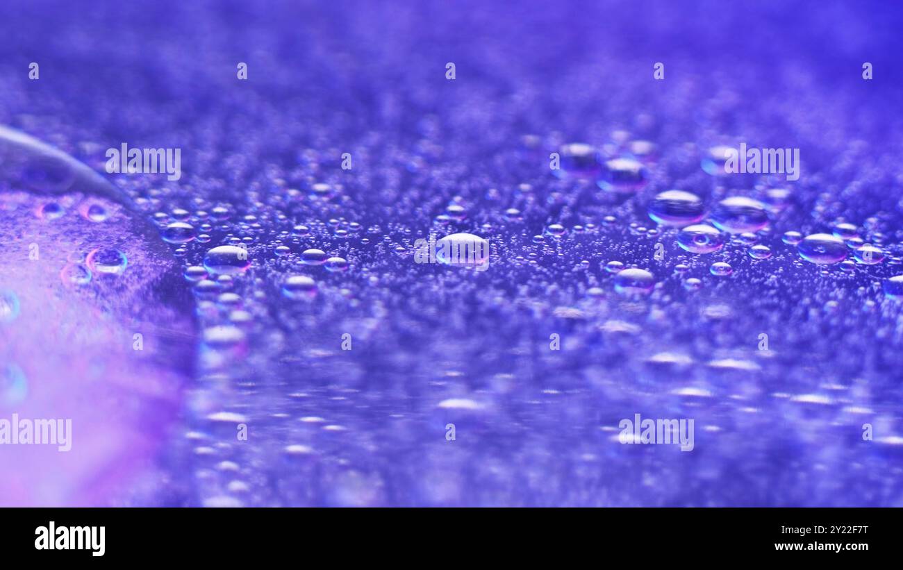 Gel fluid. Droplet floating. Defocused purple color glitter translucent ...