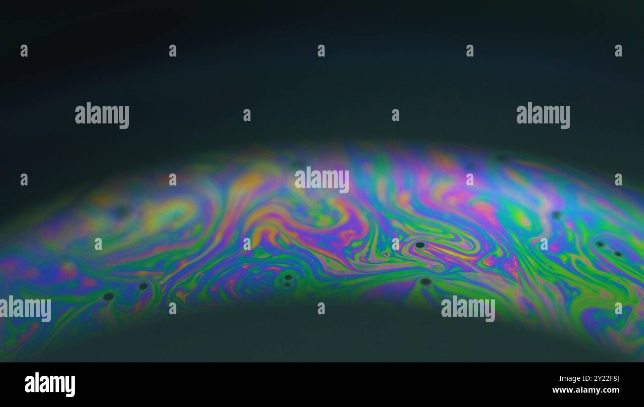 Psychedelic ink. Rainbow fluid. Defocused colorful oil bubble acid ...
