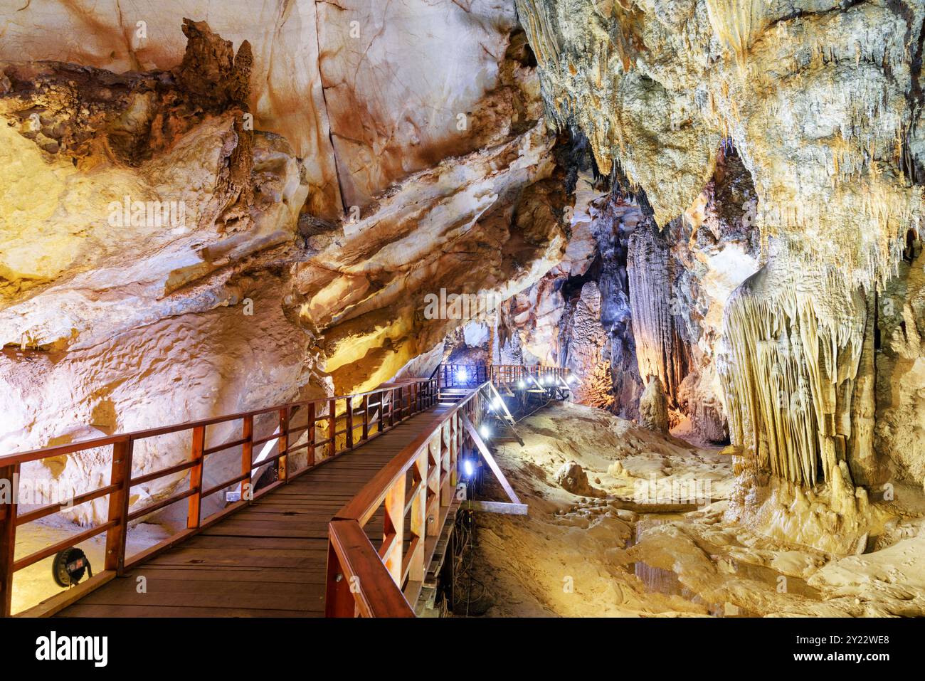 Wooden walkway through natural corridor inside Paradise Cave Stock ...