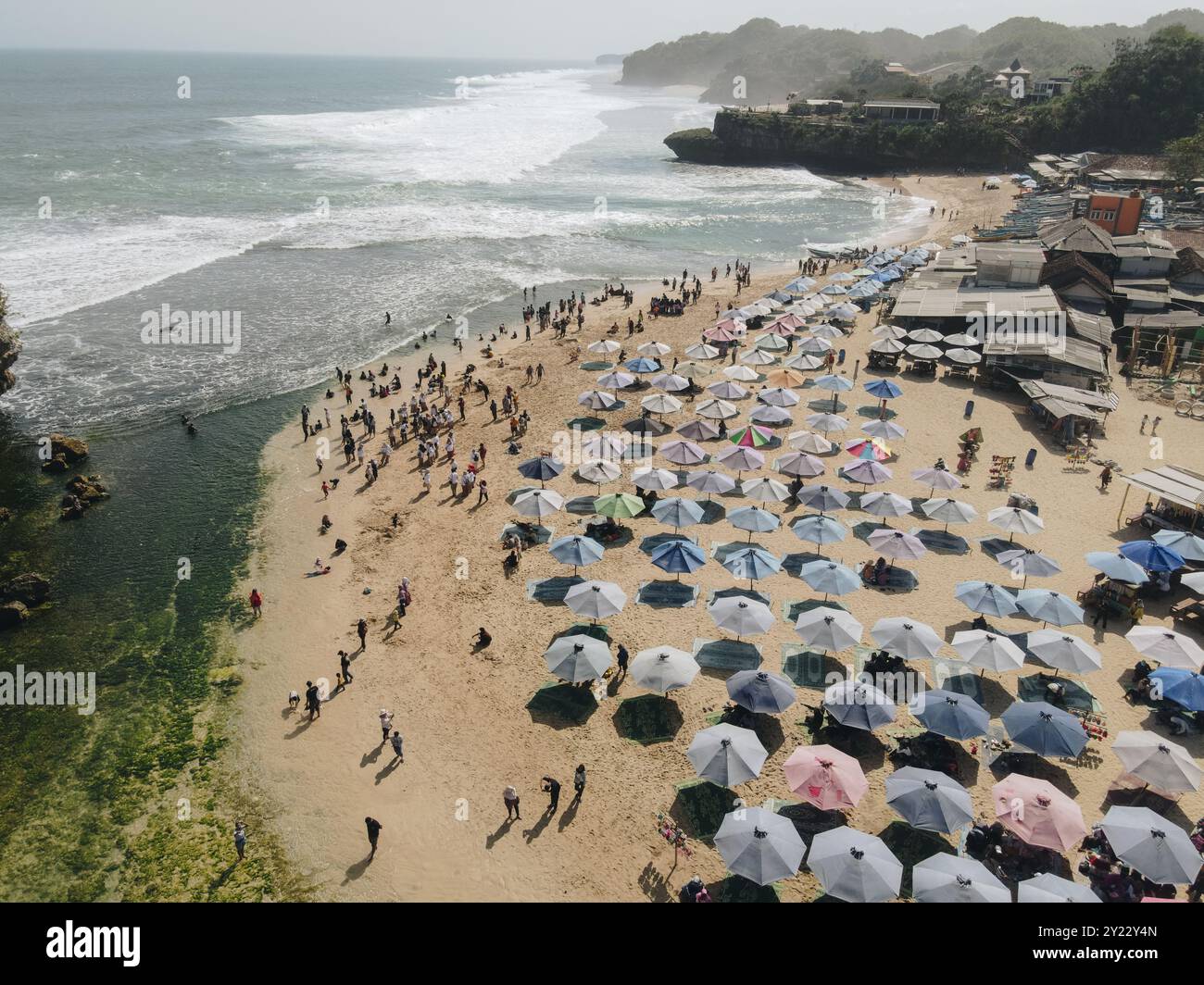 Aerial view of Drini Beach in Gunungkidul, Yogyakarta, Indonesia with white sand beaches ...