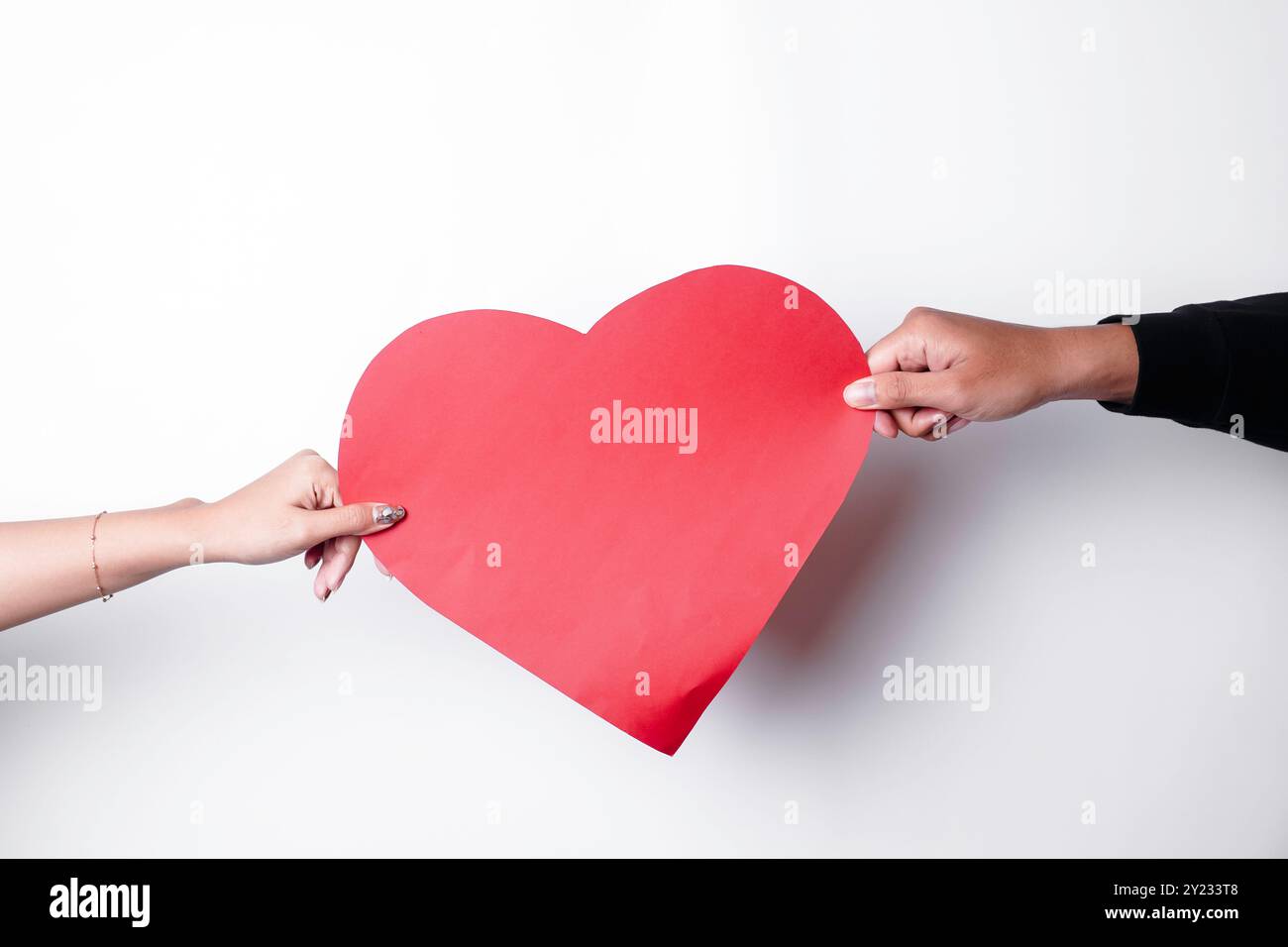 A photo of a red heart shape paper isolated on white background Stock ...