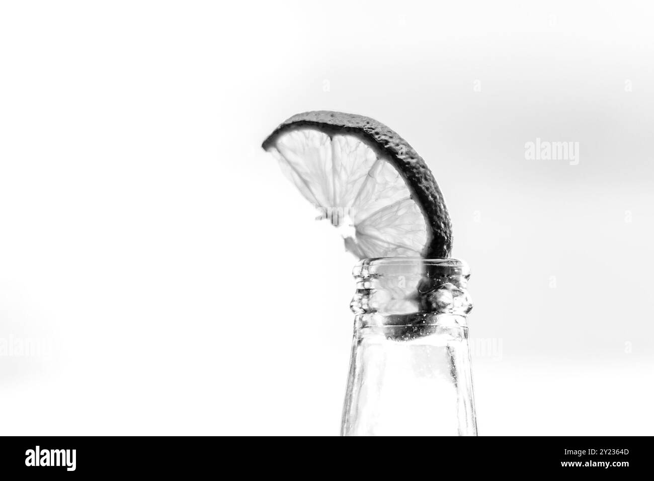Isolated Lime in Glass Bottle: Minimalist Composition on White ...