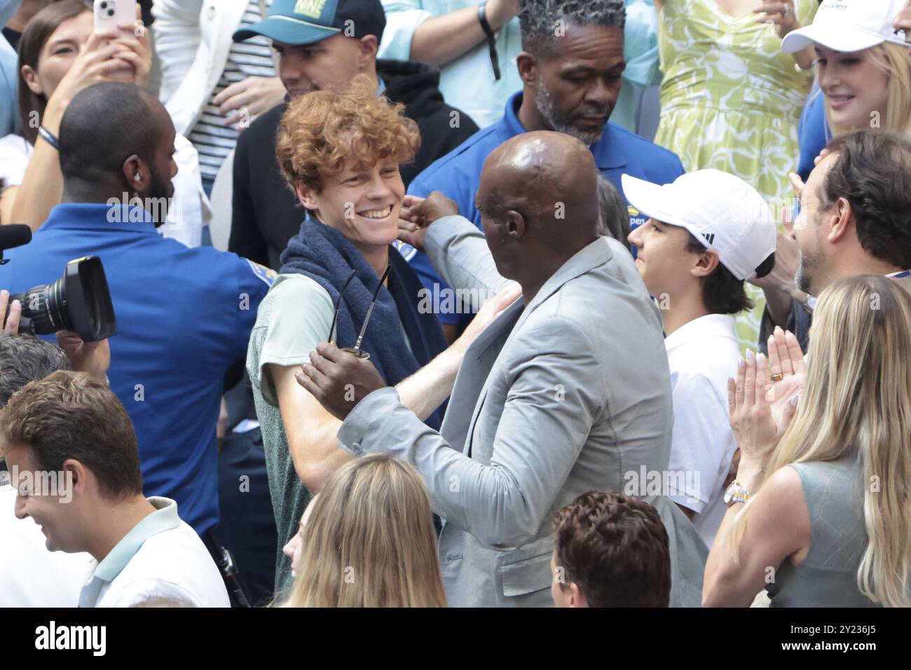 Jannik Sinner of Italy celebrates with Seal after winning the men's ...